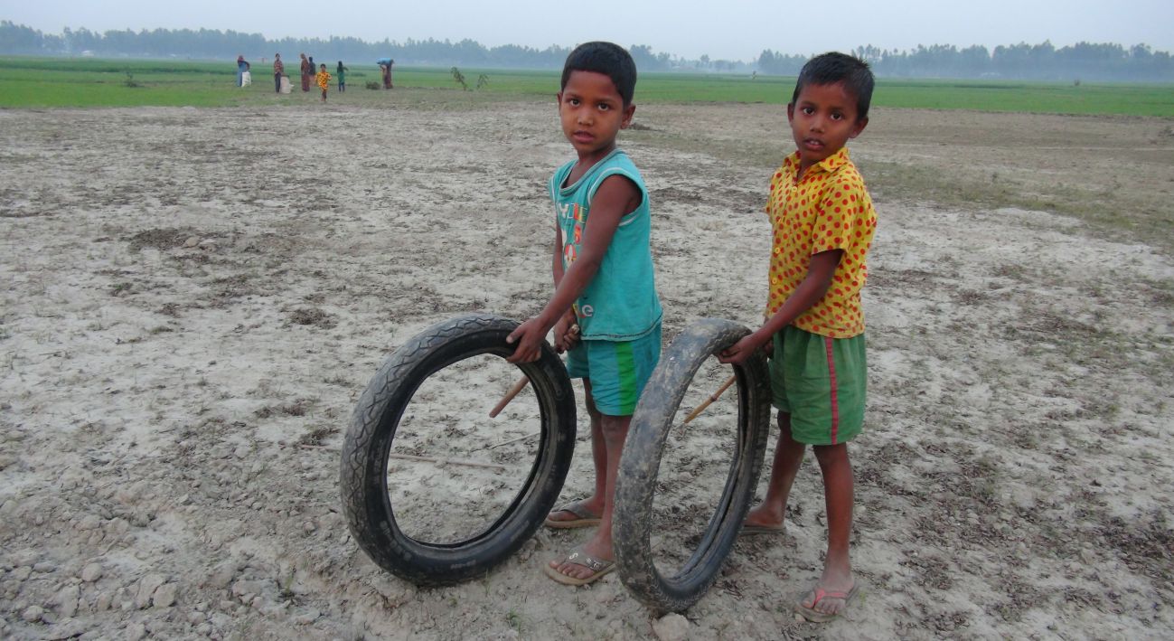 Rolling Tyre with Stick - Traditional Sports & Games Pakistan Association